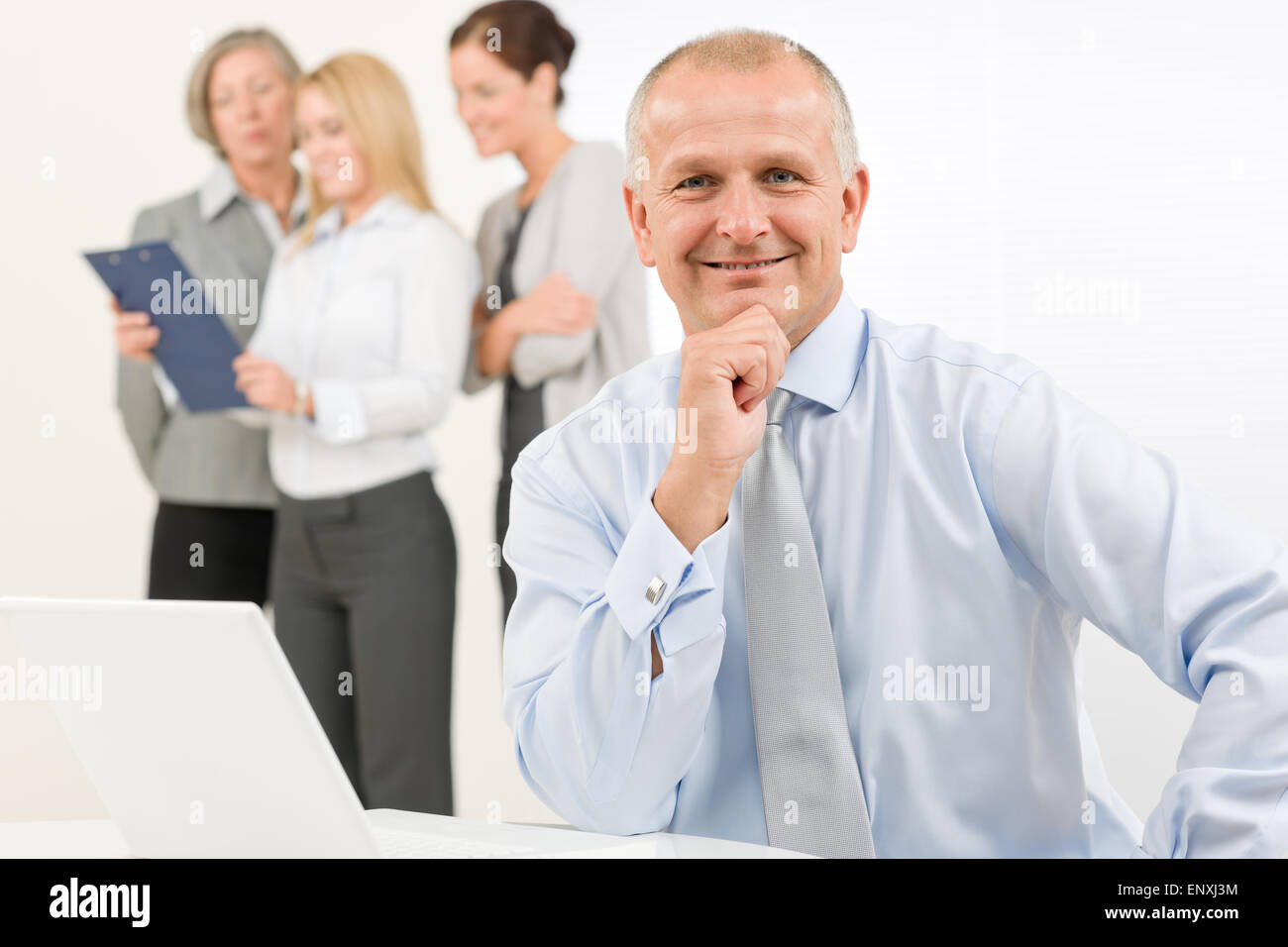 Business team senior manager with work colleagues Stock Photo - Alamy