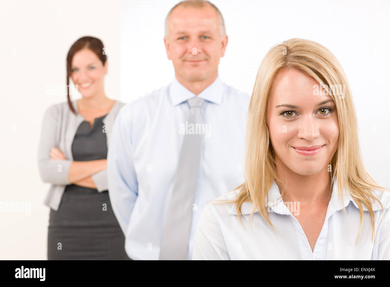Business team happy standing in line portrait Stock Photo - Alamy