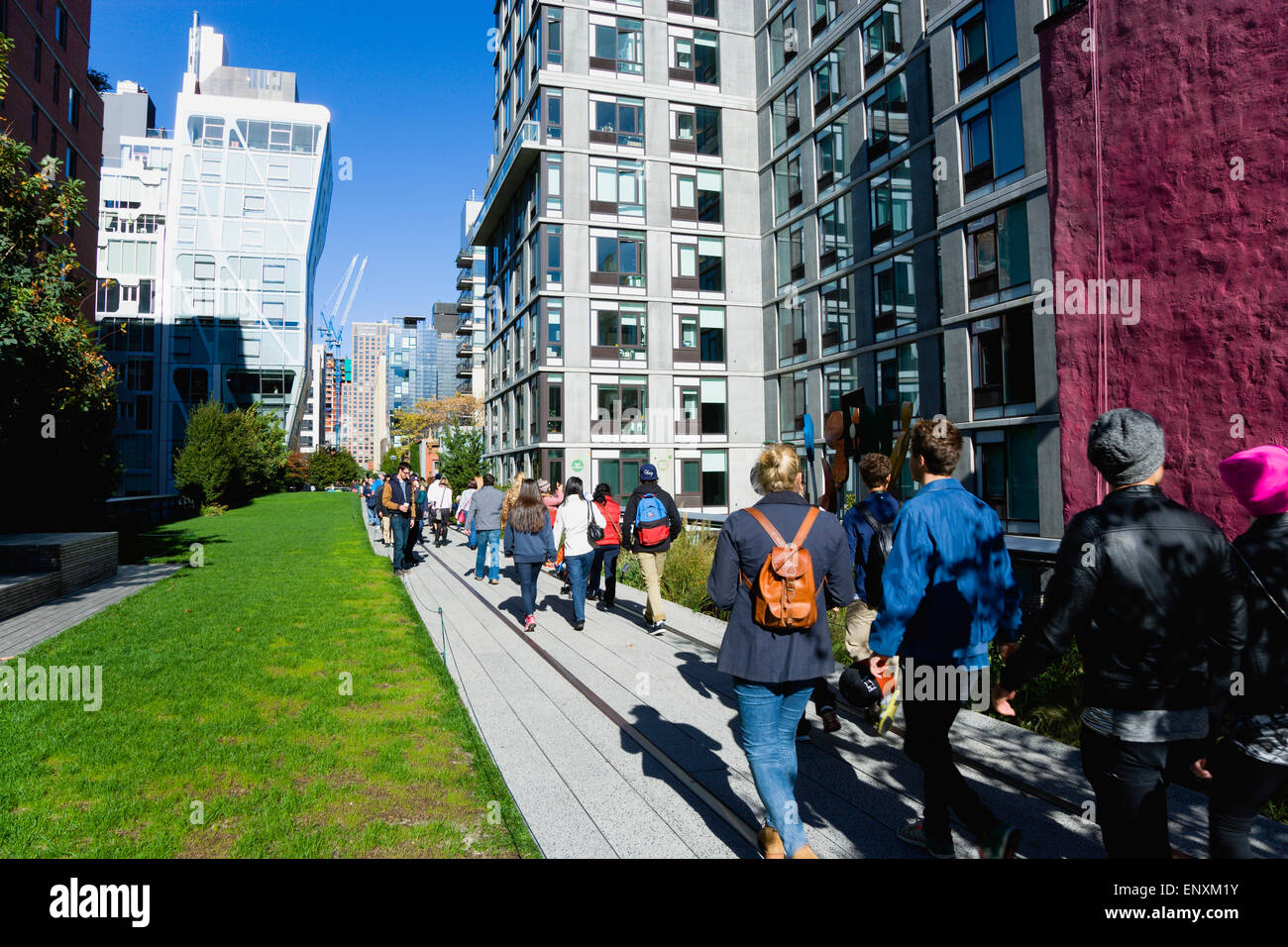 USA, New York, Manhattan, High Line linear park between buildings on a ...