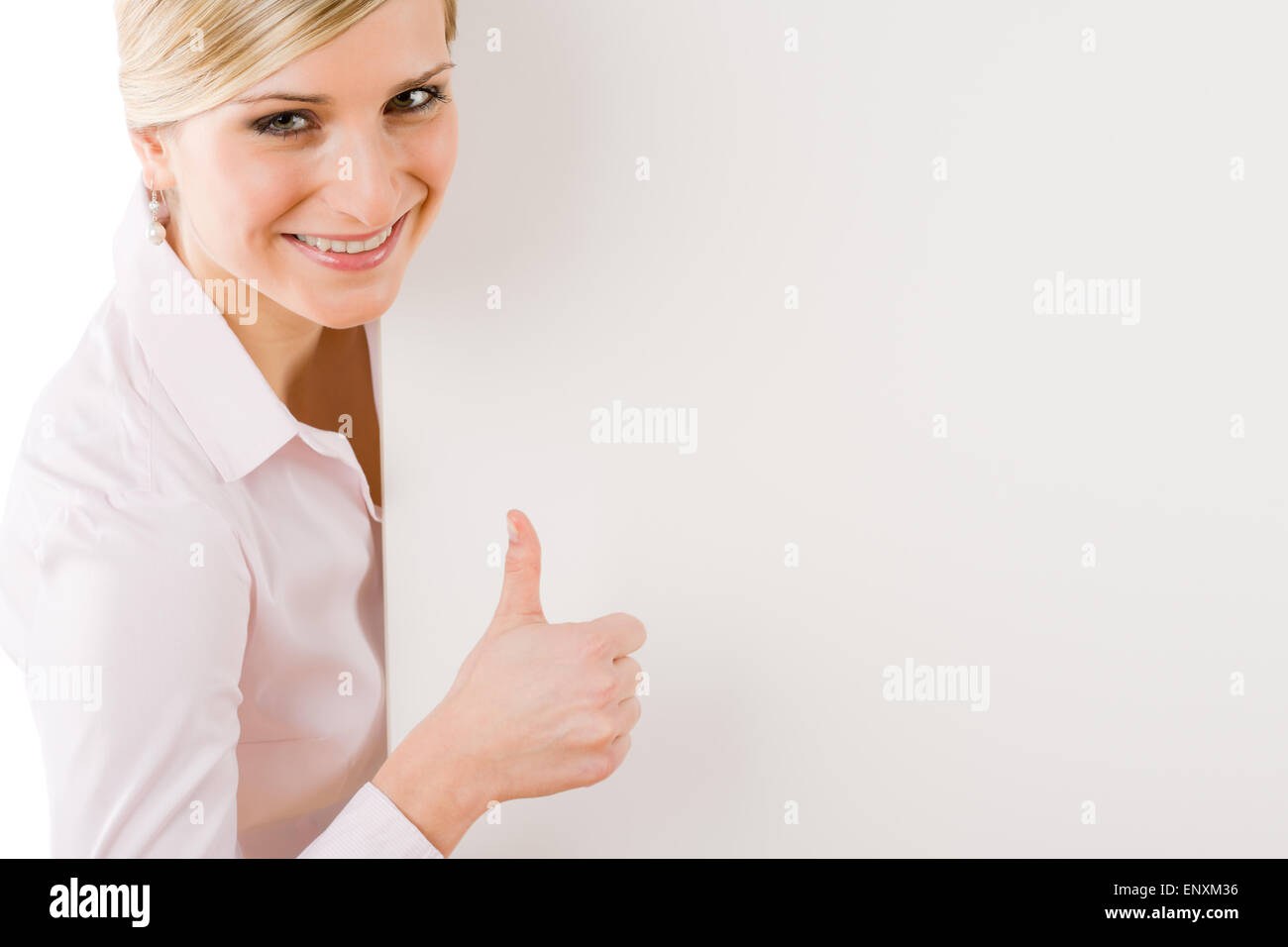 Happy businesswoman behind empty banner thumbs up Stock Photo - Alamy Happy businesswoman behind empty banner thumbs up Stock Photo - Alamy