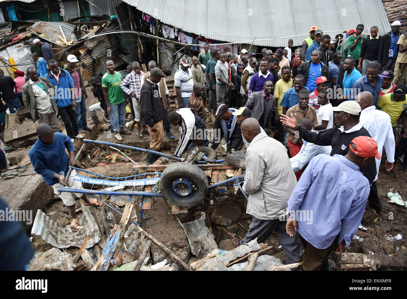Nairobi, Kenya. 12th May, 2015. Rescuers remove debris at the site of a ...