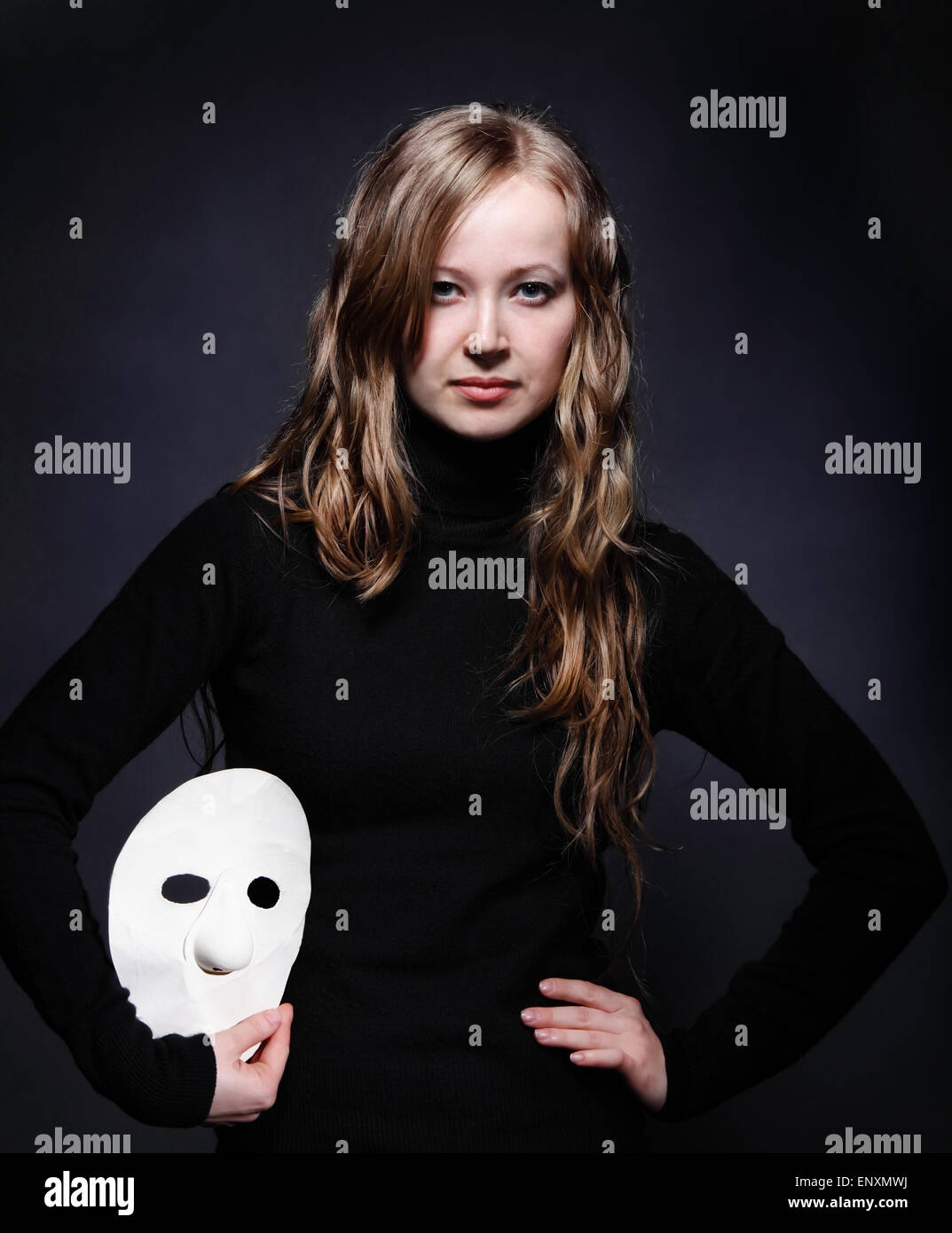Low key portrait of a beautiful girl with mask Stock Photo - Alamy