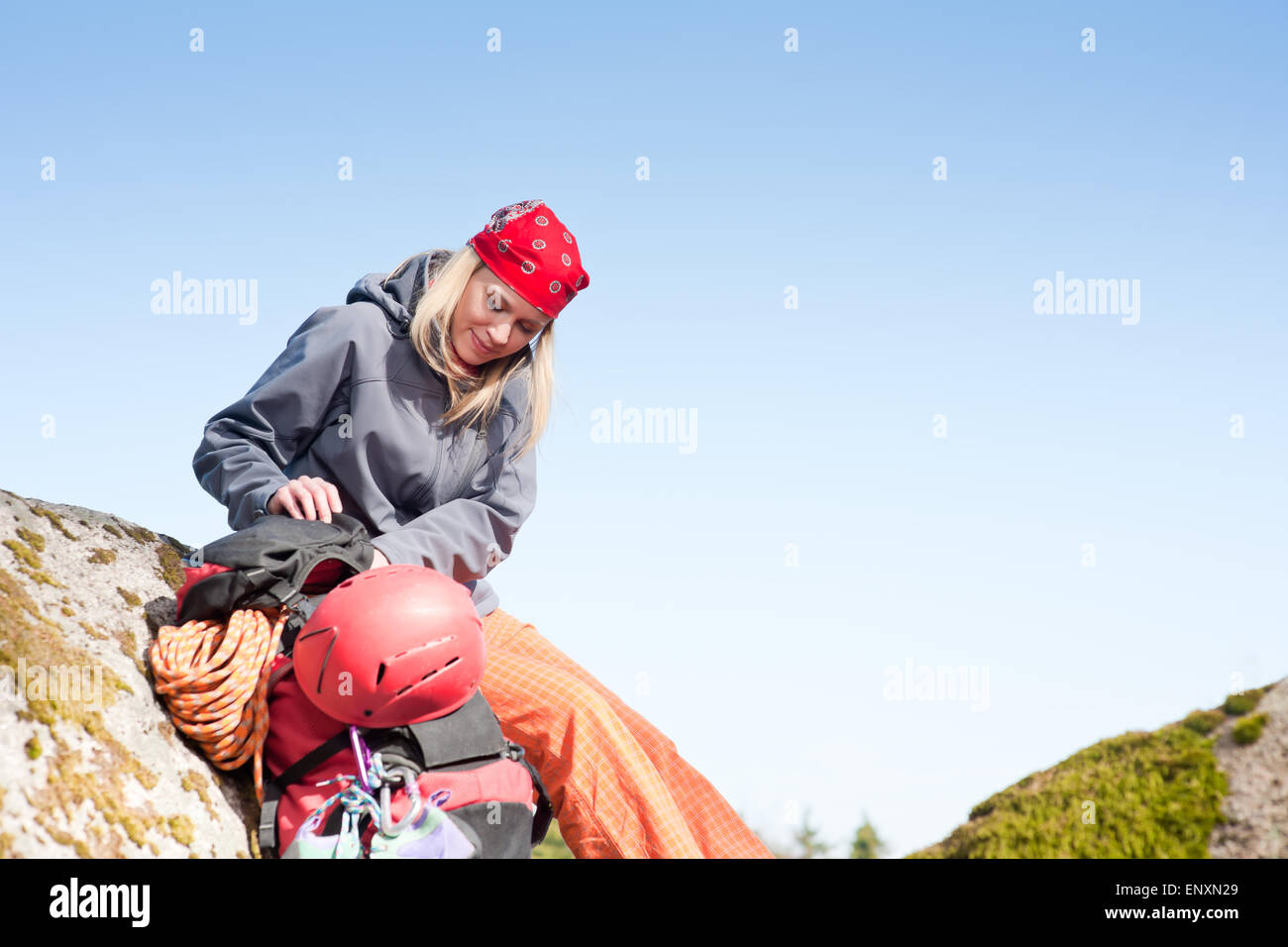 Active woman rock climbing relax with backpack Stock Photo - Alamy