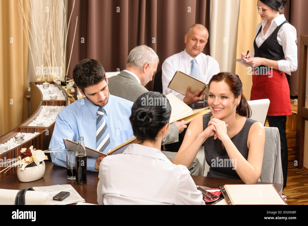 Business lunch executives look menu restaurant Stock Photo - Alamy