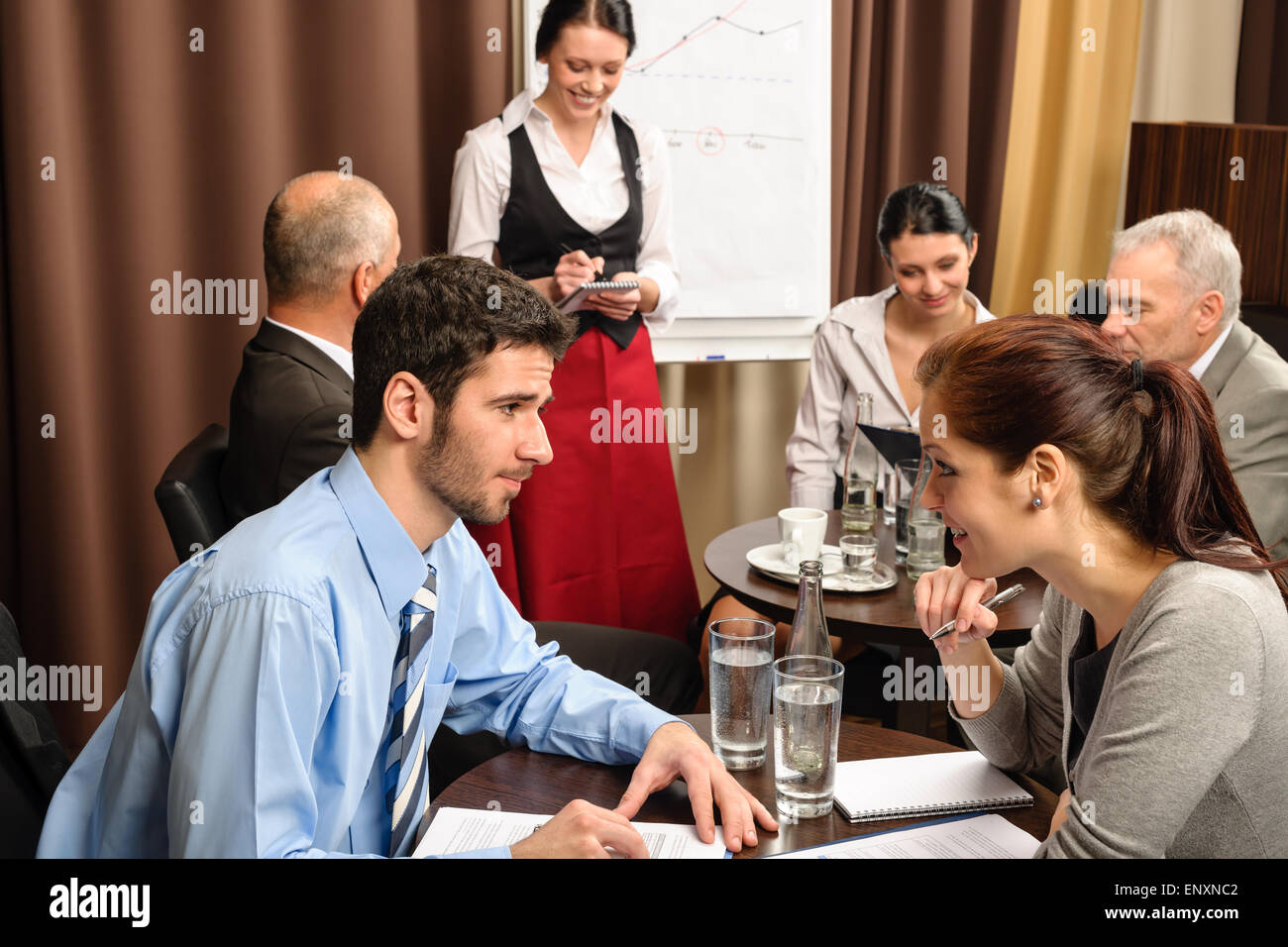 Businesspeople conference room waitress take order Stock Photo - Alamy