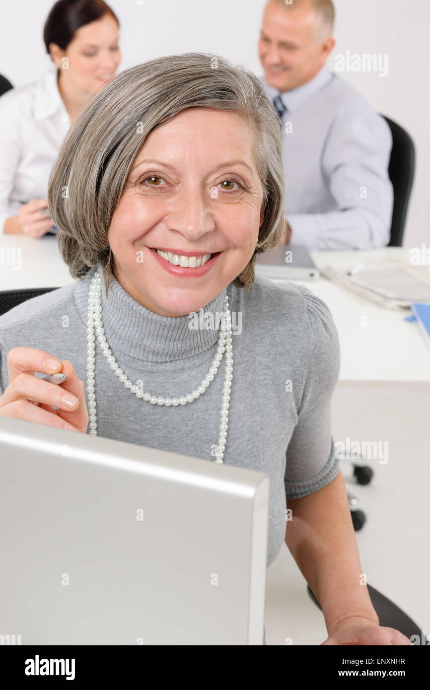 Business team senior manager woman with colleagues Stock Photo - Alamy