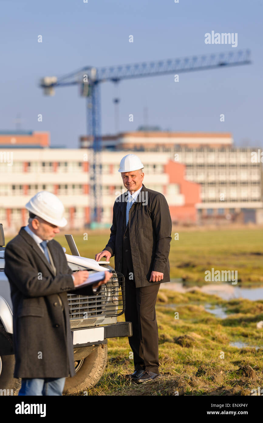 Architect man make notes on construction site Stock Photo - Alamy