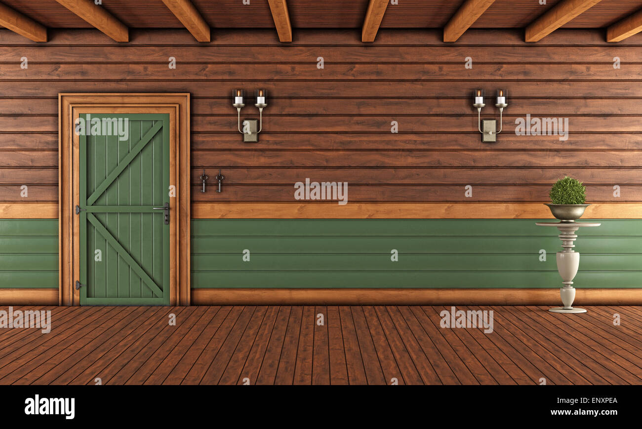 Living room of a wooden house with closed front door without furniture ...
