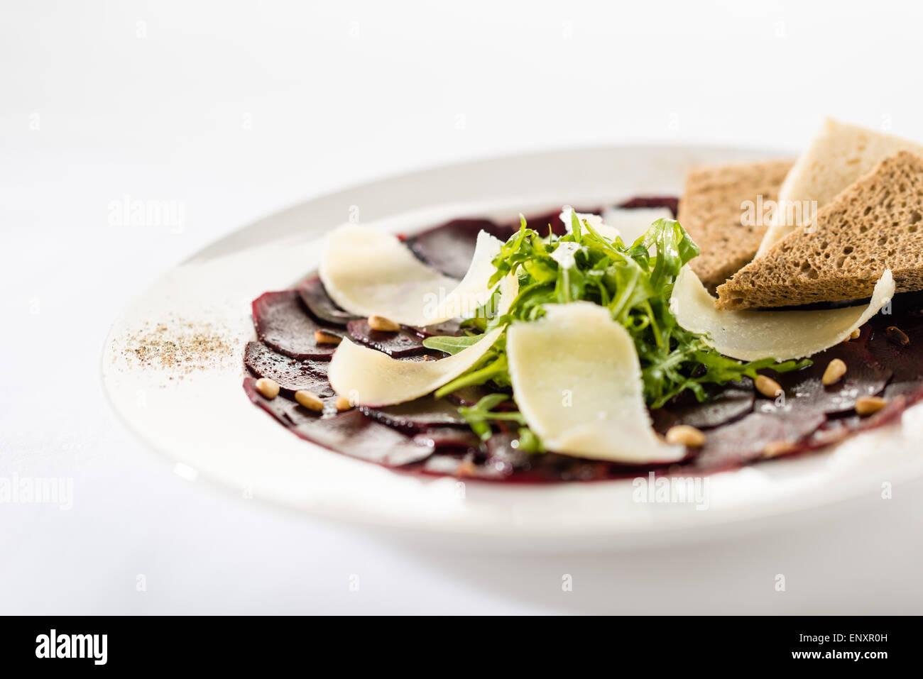 Vegetarian carpaccio with beetroot,nuts and toast Stock Photo - Alamy