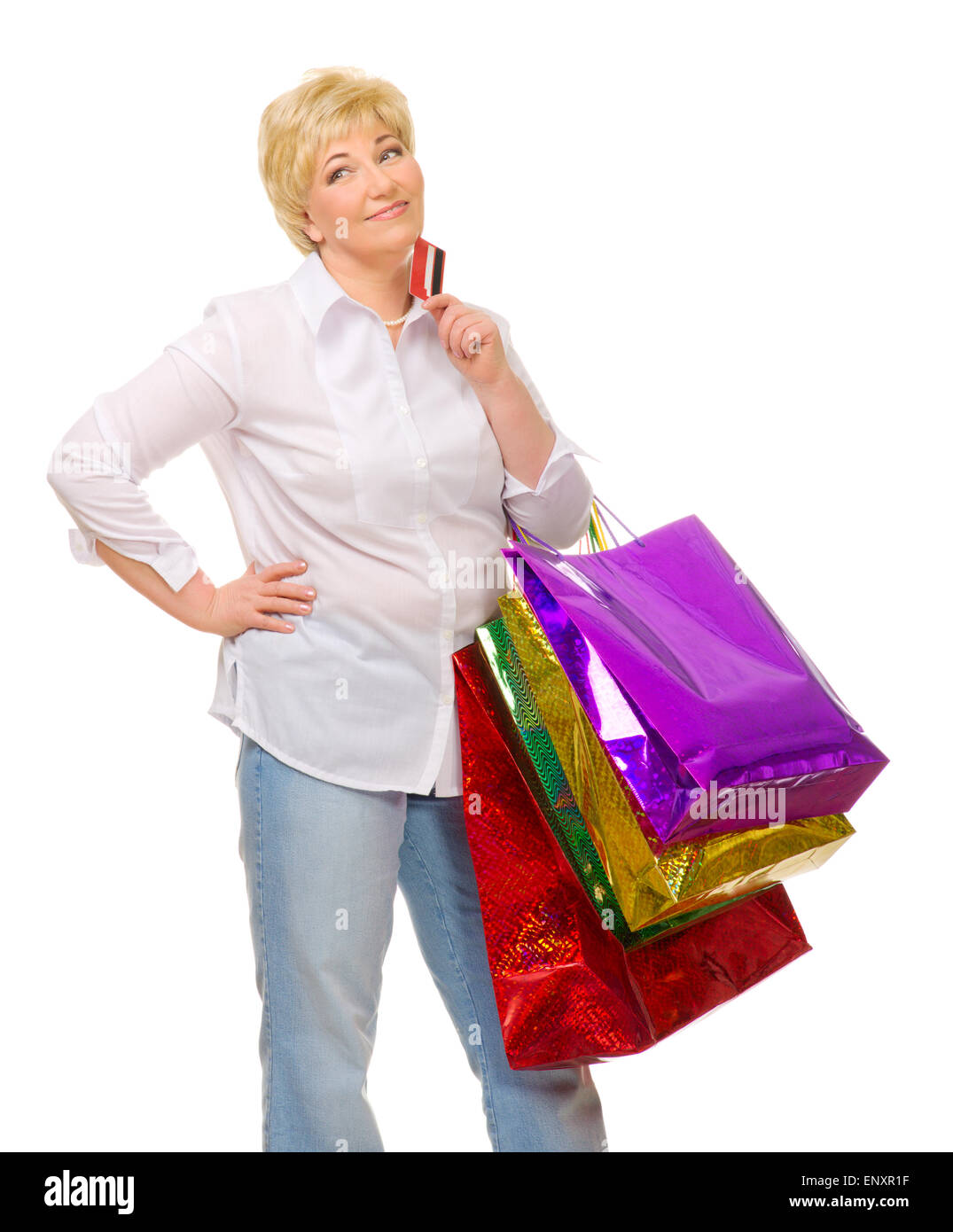 Senior woman with bags and credit card isolated Stock Photo - Alamy