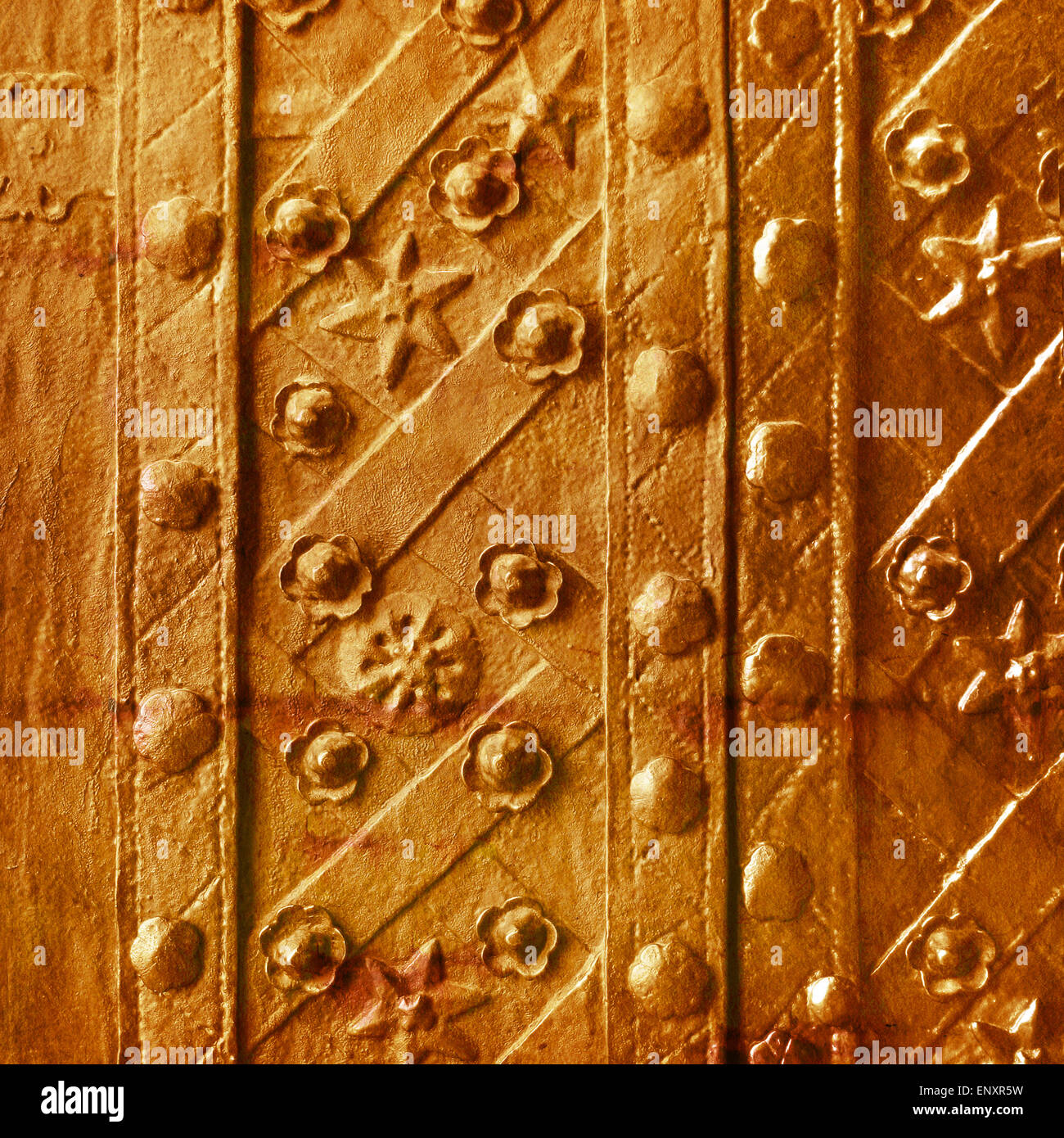 Old gold plate with a pattern of convex and star colors Stock Photo - Alamy