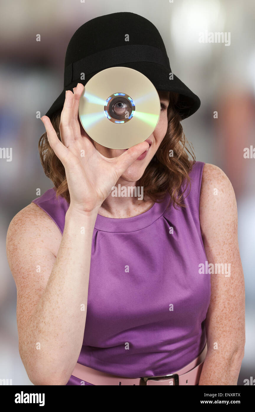 Woman holding CD or DVD Stock Photo - Alamy