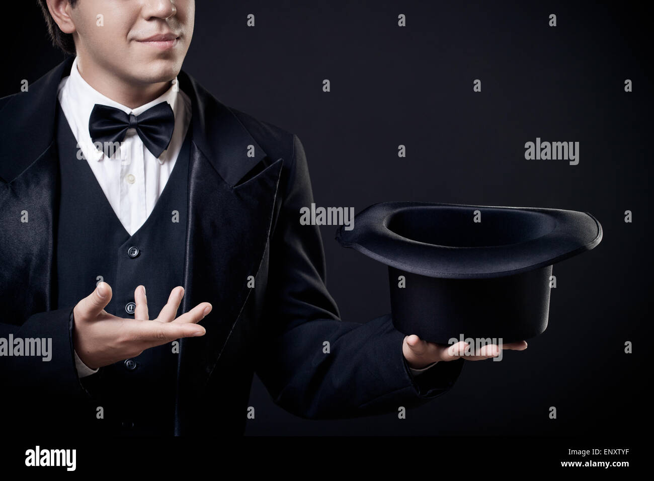 magician showing tricks with top hat isolated Stock Photo - Alamy