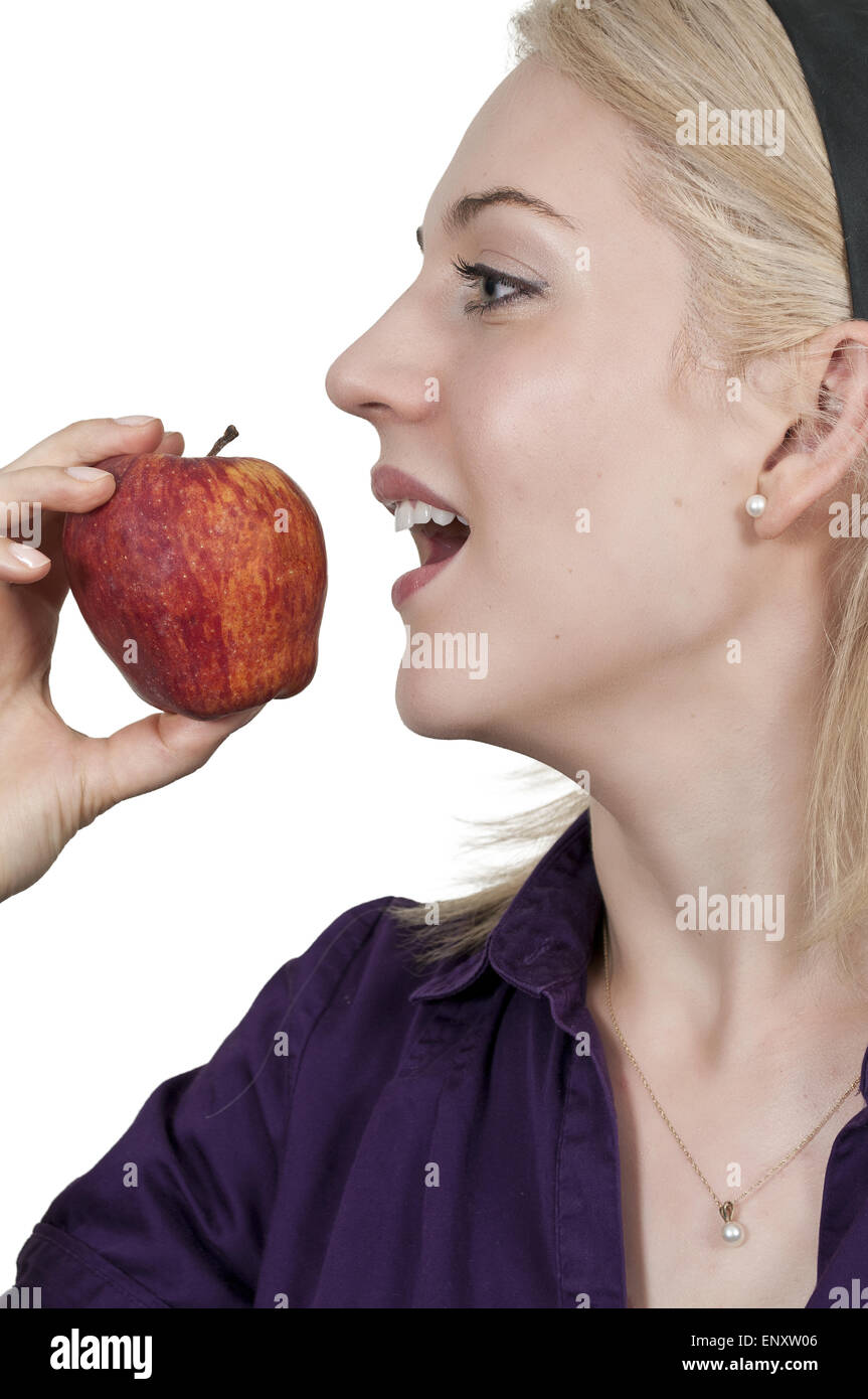Woman Eating an Apple Stock Photo - Alamy