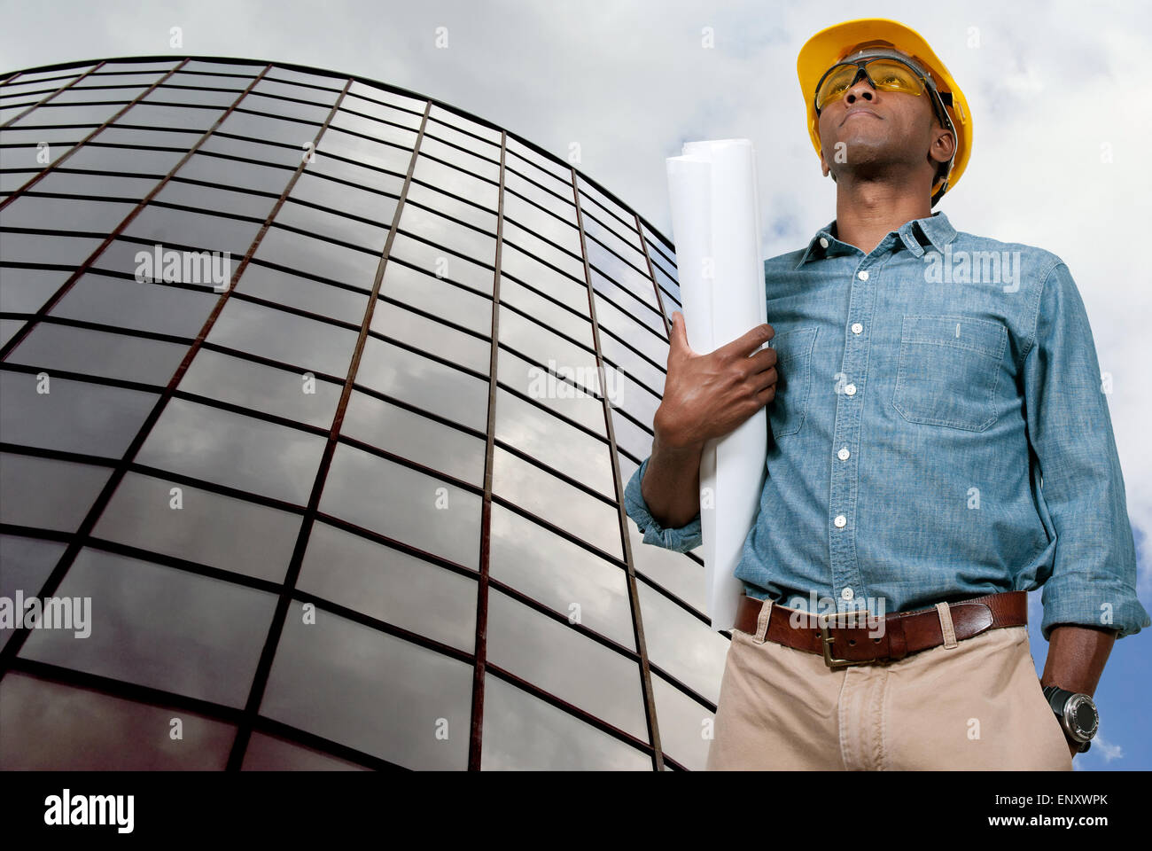 Construction Worker with Blueprints Stock Photo - Alamy