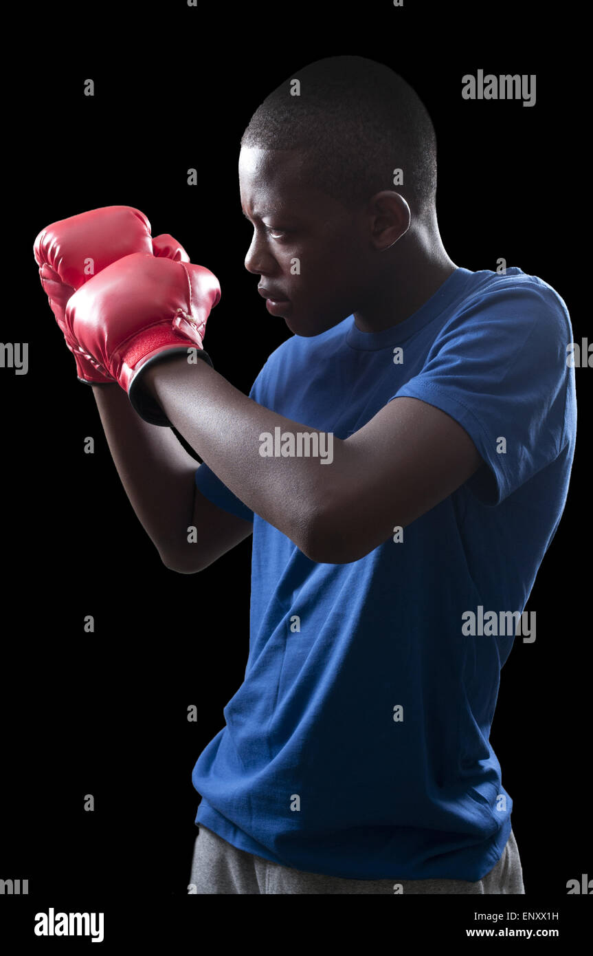 Teen boy red boxing gloves hi-res stock photography and images - Alamy