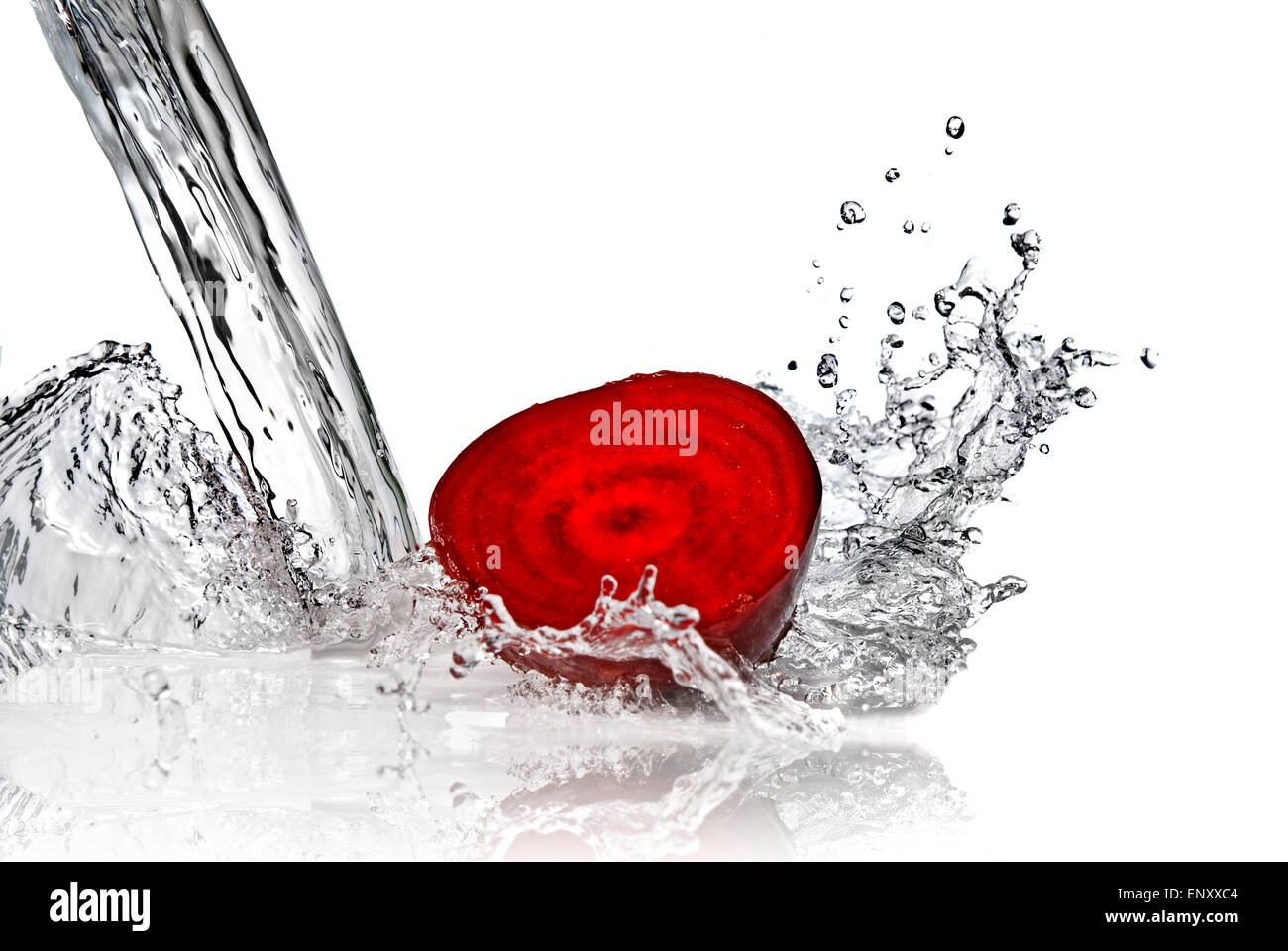red beet with water splash isolated on white Stock Photo - Alamy