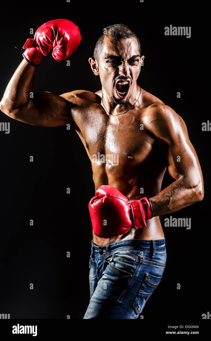 Young man with boxing gloves Stock Photo - Alamy