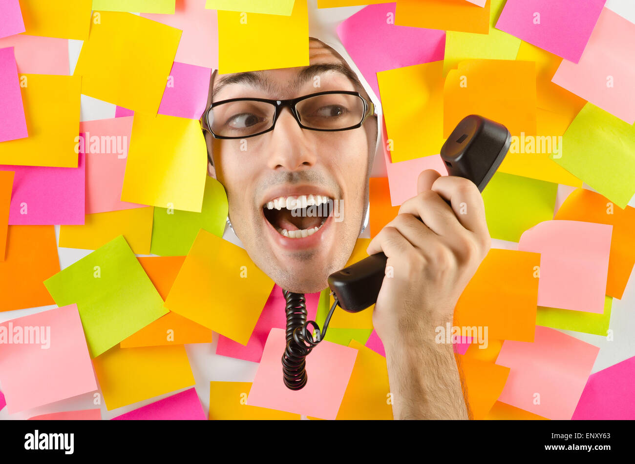 Man's face through paper and reminders Stock Photo - Alamy