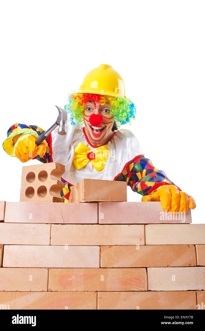 Bad construction concept with clown laying bricks Stock Photo - Alamy
