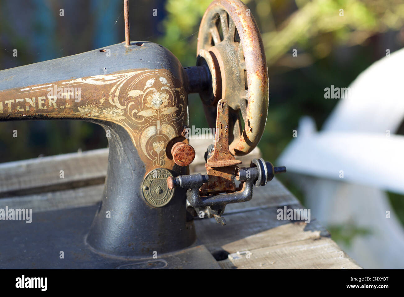 old sewing machine stands on the street Stock Photo - Alamy