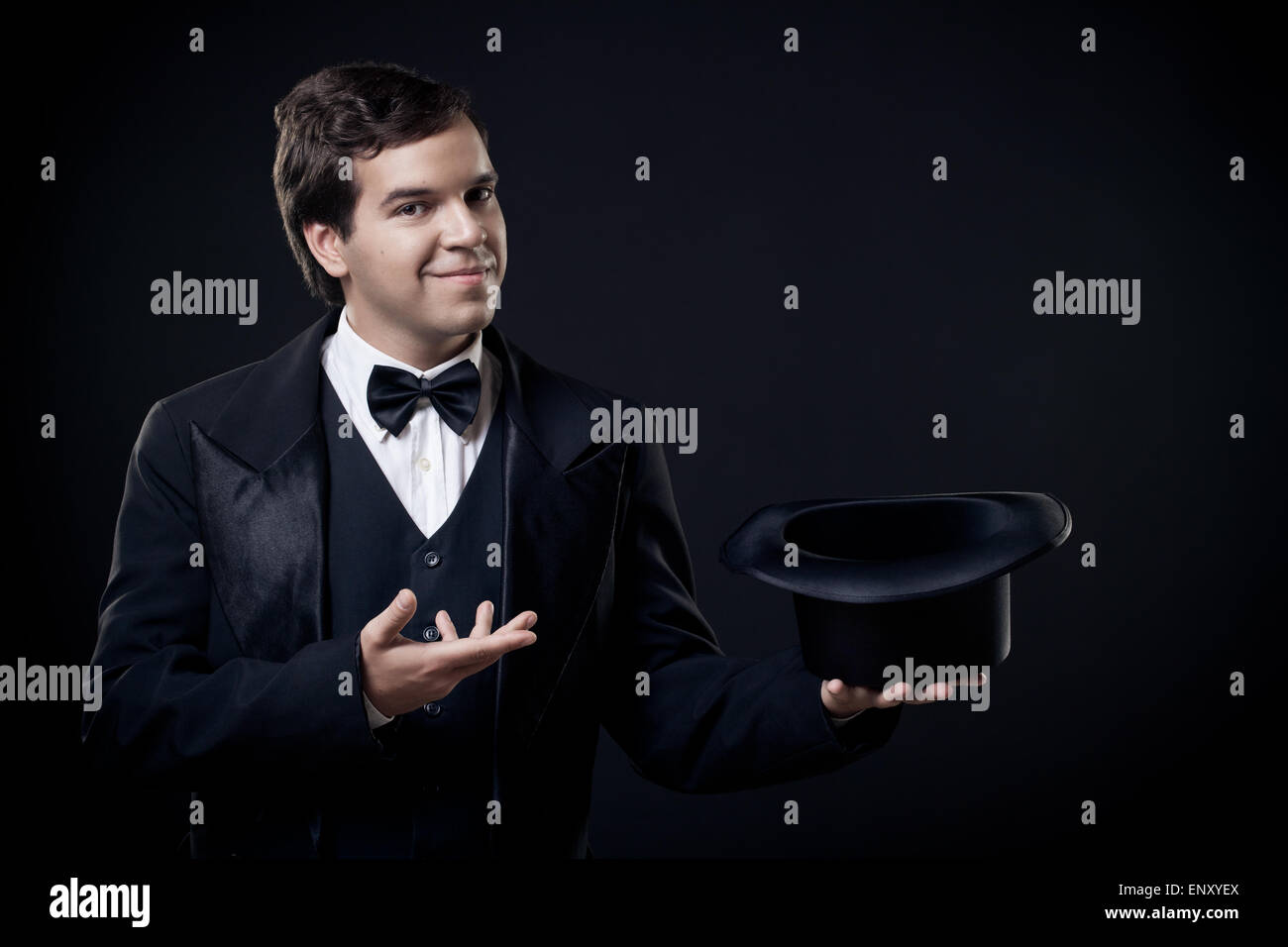 magician showing tricks with top hat isolated Stock Photo - Alamy