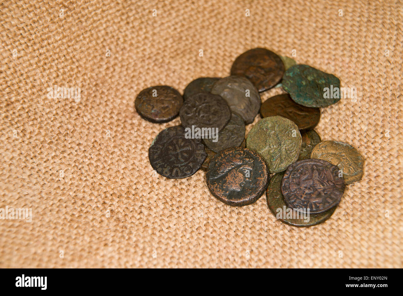 A lot of old coins with portraits of kings on the old cloth Stock Photo ...