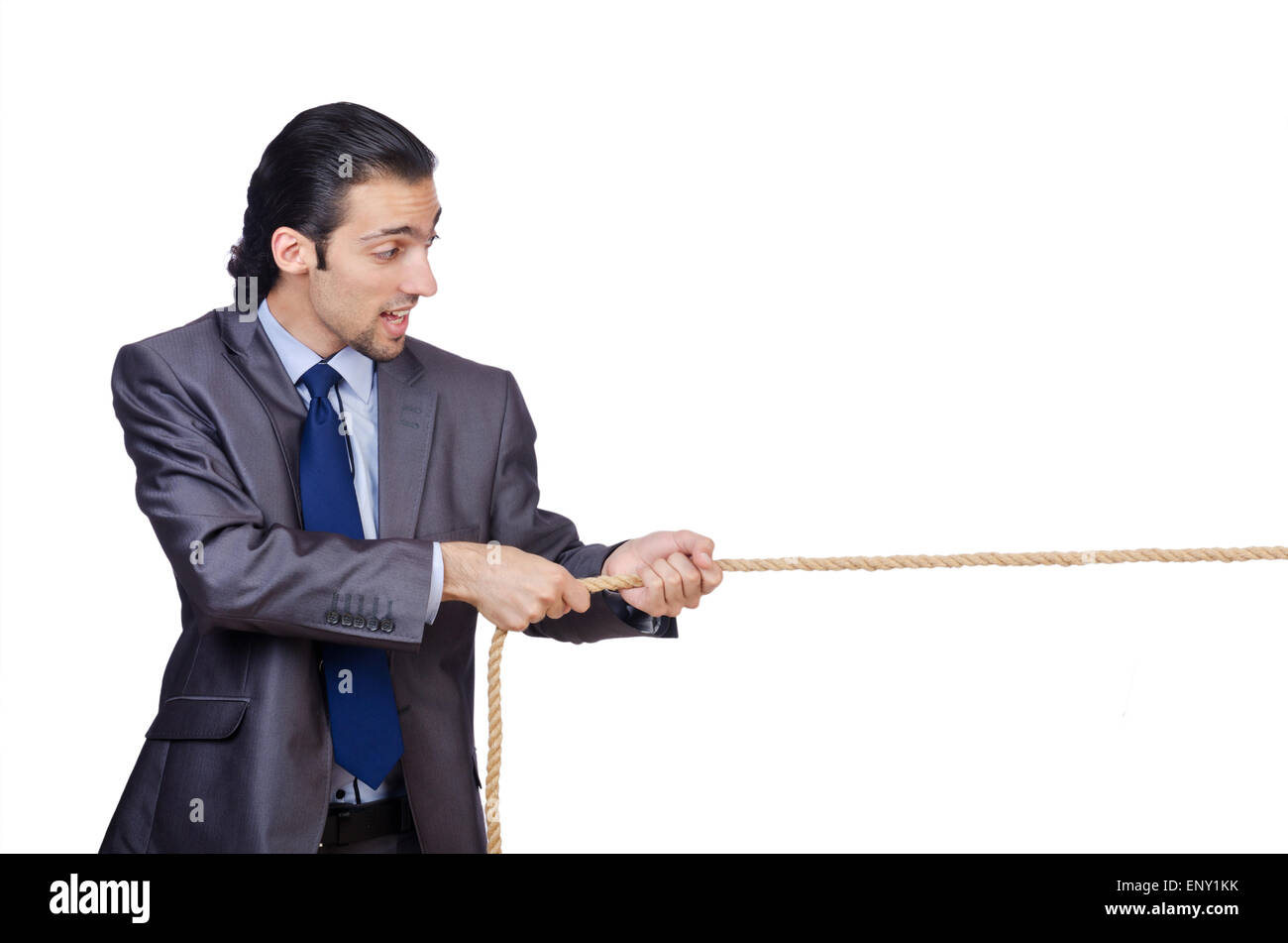 Businessman pulling rope on white Stock Photo - Alamy