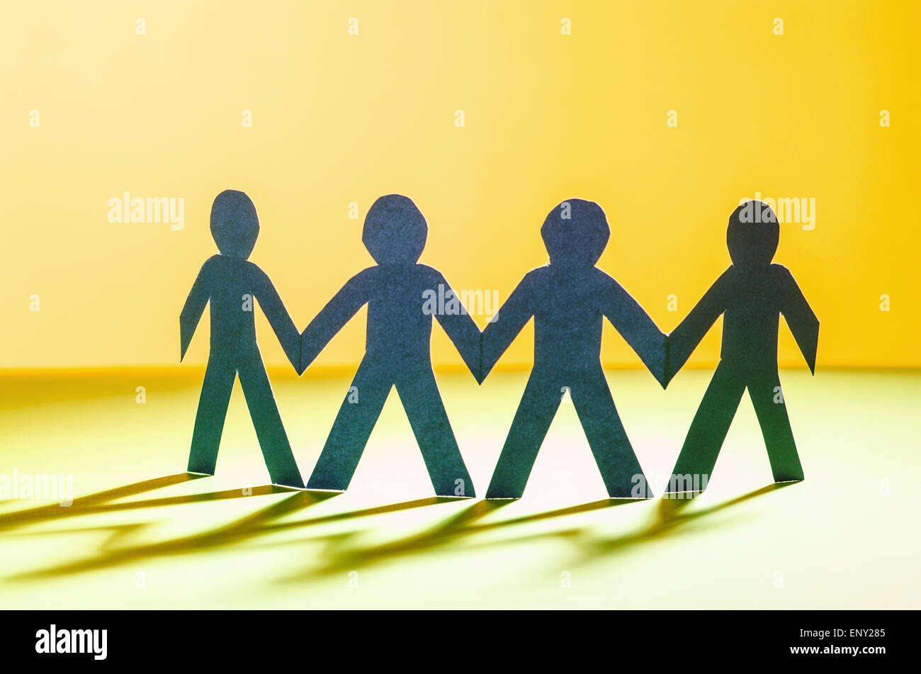 Paper people in teamworking concept Stock Photo - Alamy