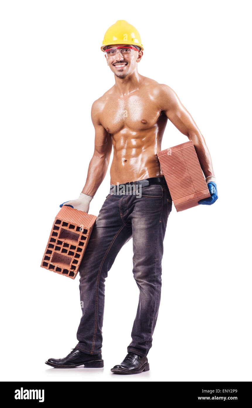 Muscular builder with bricks on white Stock Photo - Alamy