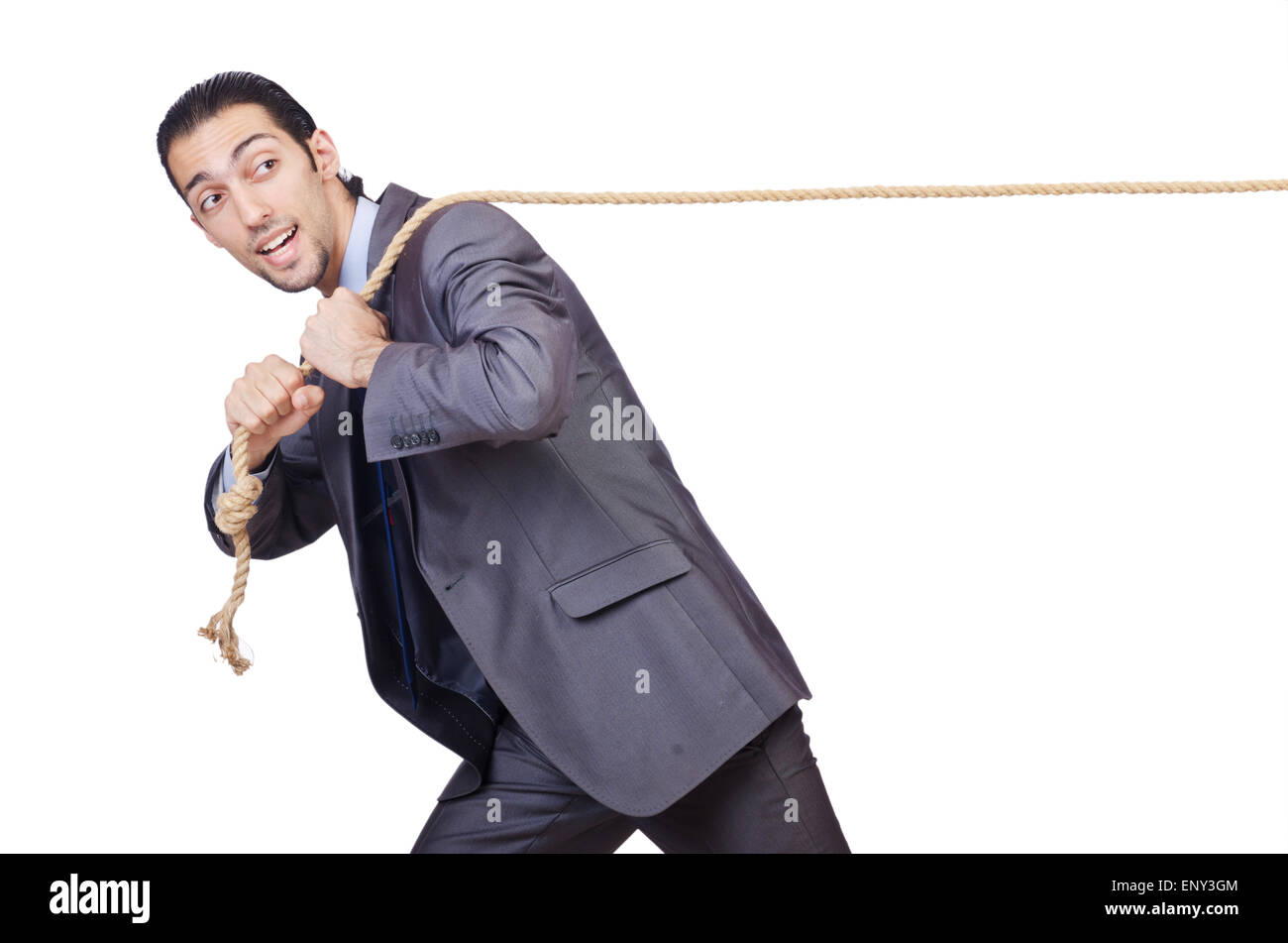 Businessman pulling rope on white Stock Photo - Alamy