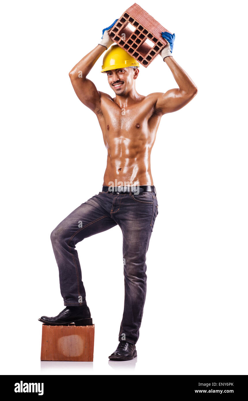 Muscular builder with bricks on white Stock Photo - Alamy