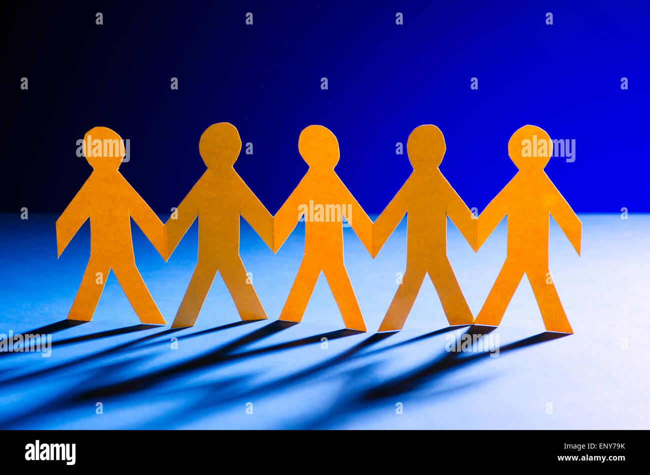 Paper people in teamworking concept Stock Photo - Alamy