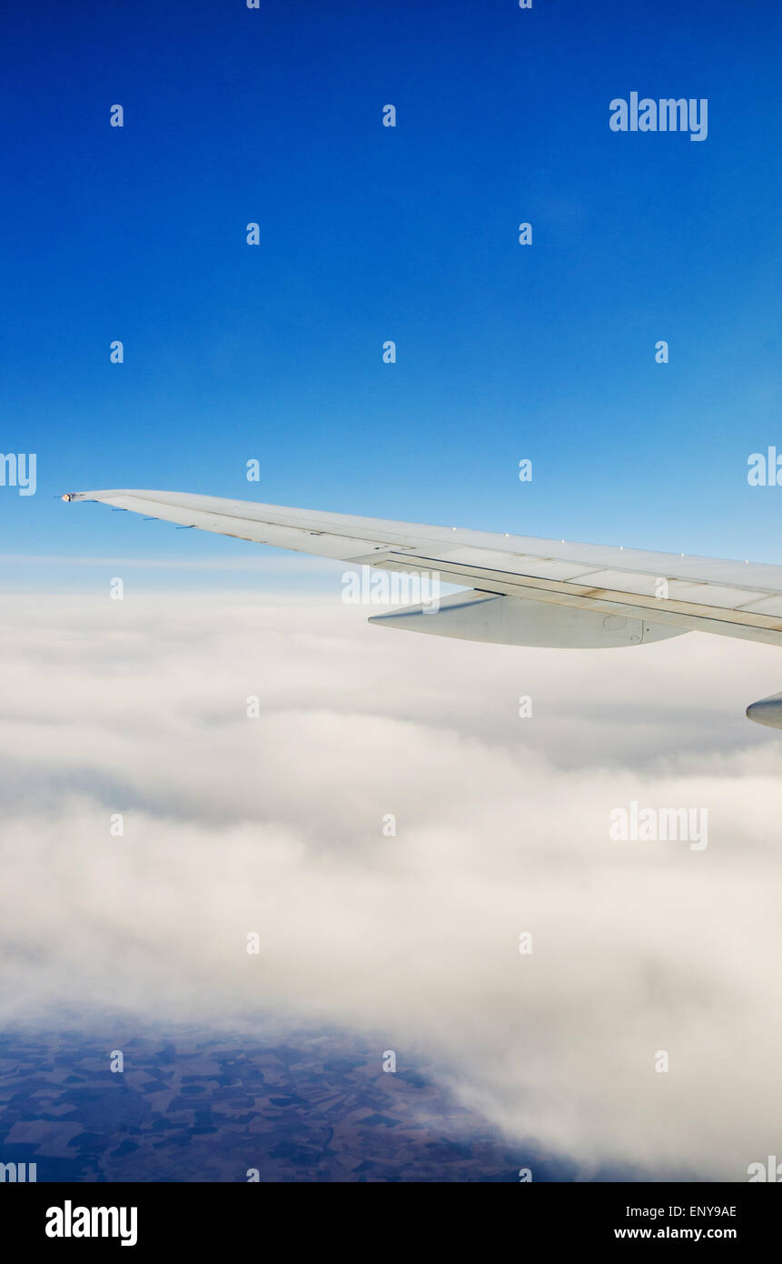Airplane wing out of window Stock Photo - Alamy