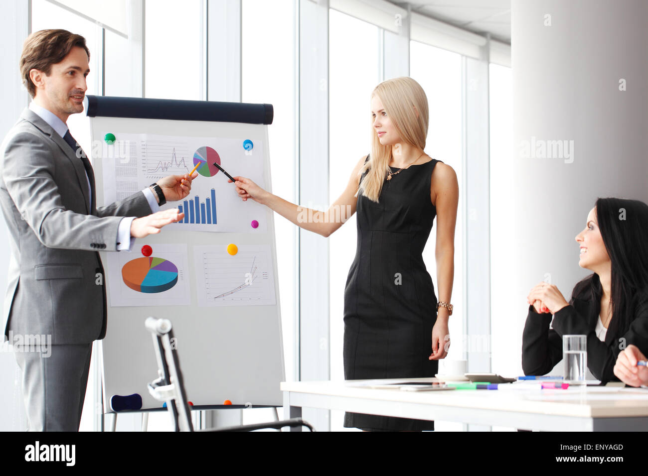 business people at financial presentation Stock Photo - Alamy