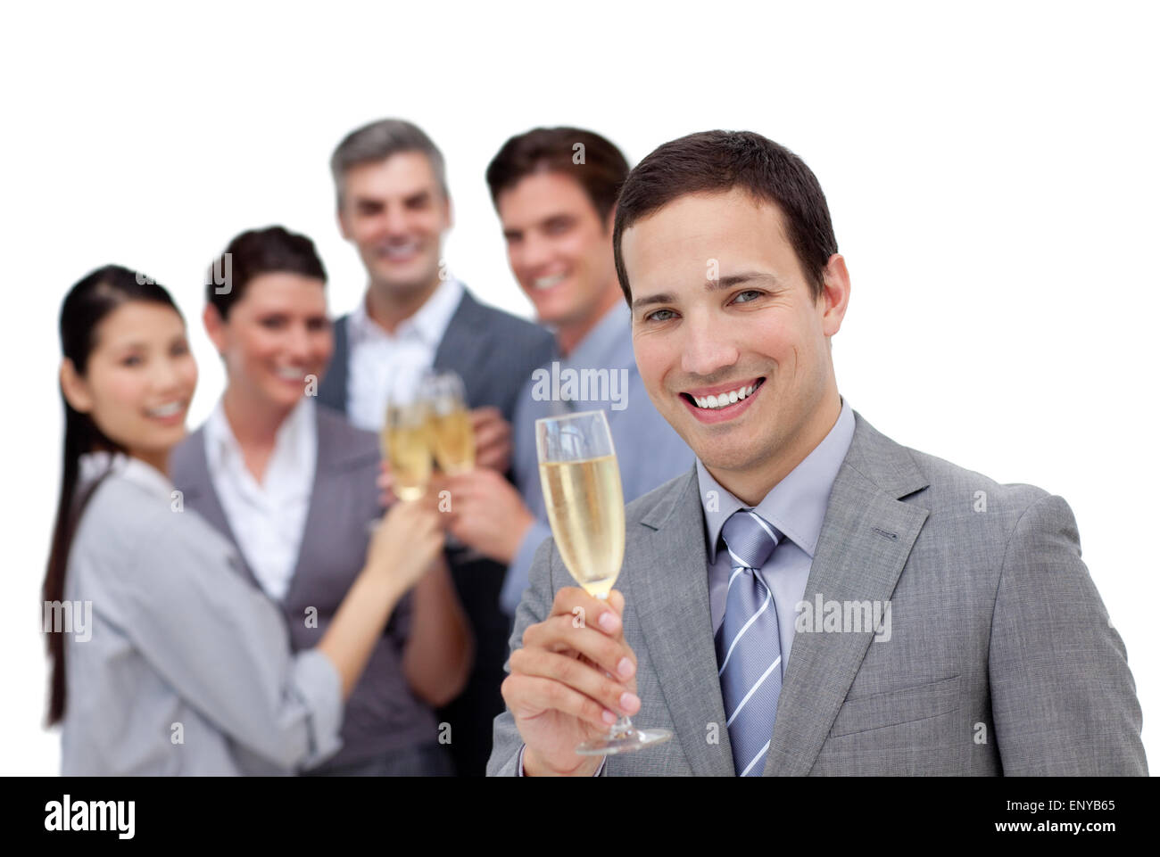 Successful business team toasting with Champagne against a white ...