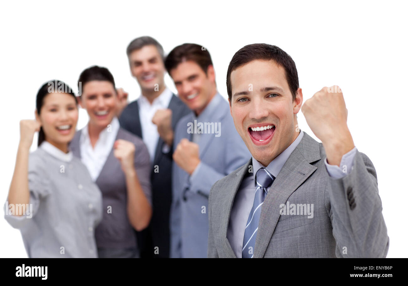 Successful business team punching the air in celebration against a ...