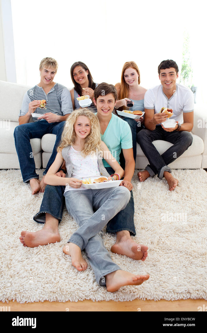 Friends eating burgers and fries Stock Photo - Alamy