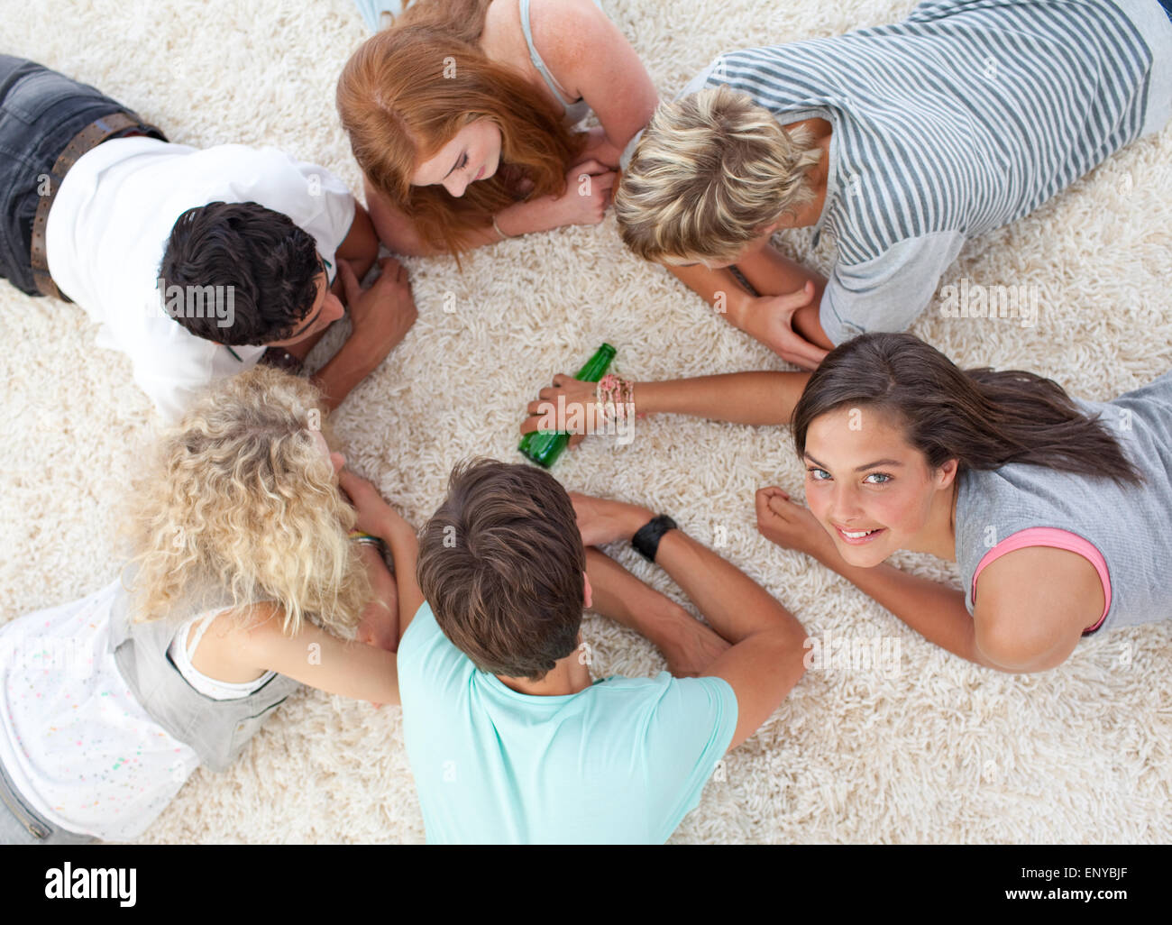 Group people playing spin bottle hi-res stock photography and images ...