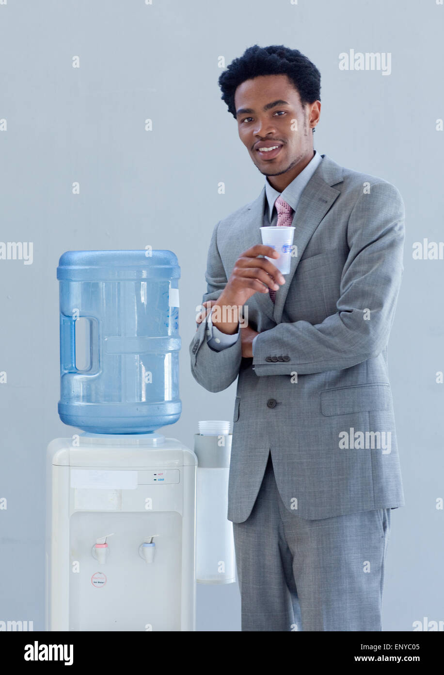 Black man drinking water cooler hi-res stock photography and images - Alamy
