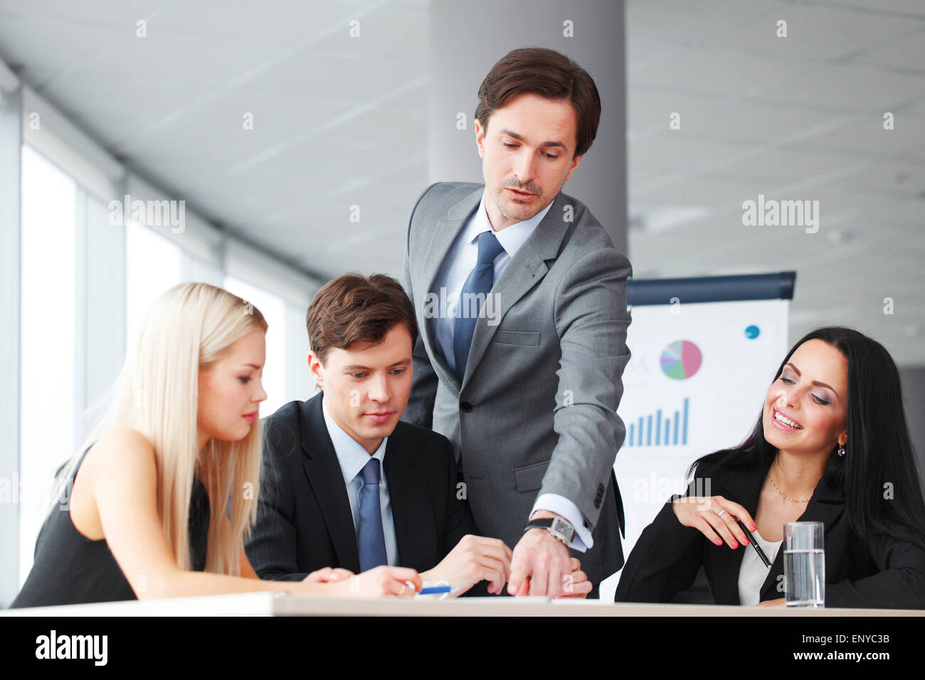 Team business executives discussing desk hi-res stock photography and ...
