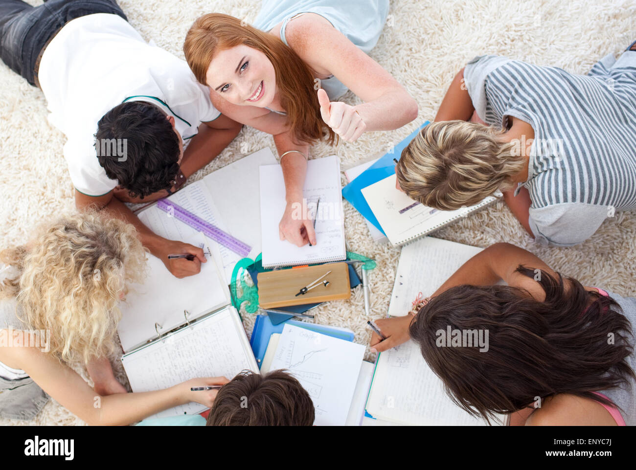 Group of Teenagers studying together Stock Photo - Alamy