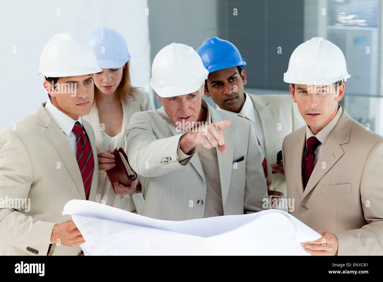 Serious male engineer blueprints hi-res stock photography and images ...