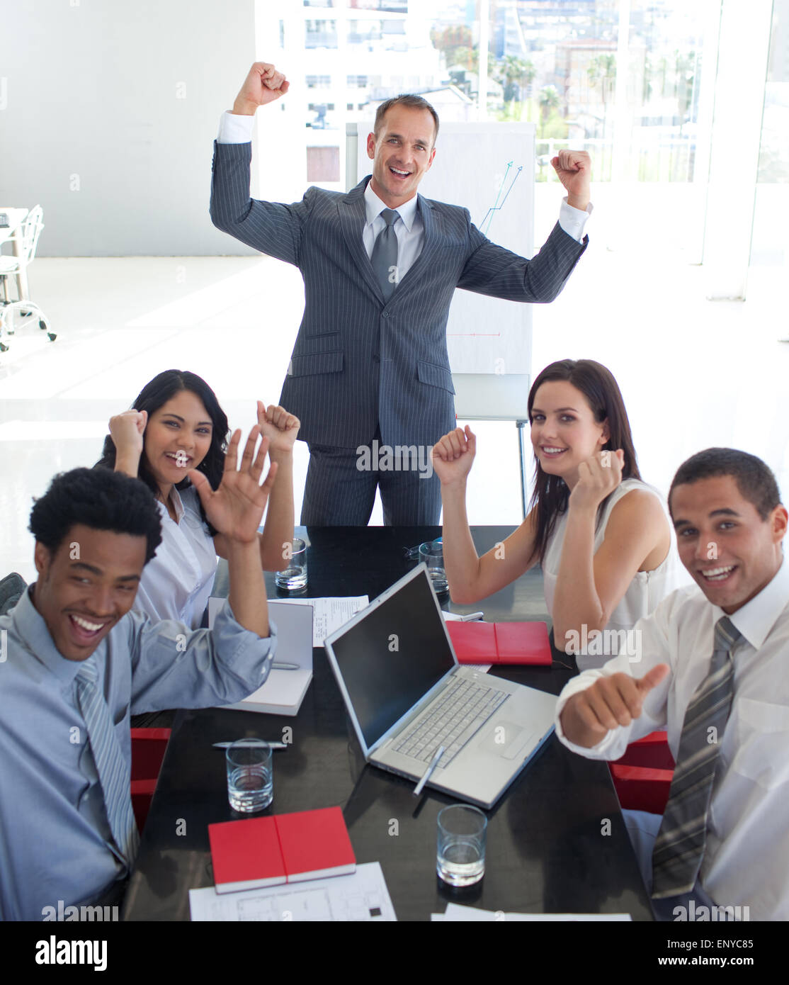 Business team in a meeting celebrating a success Stock Photo - Alamy