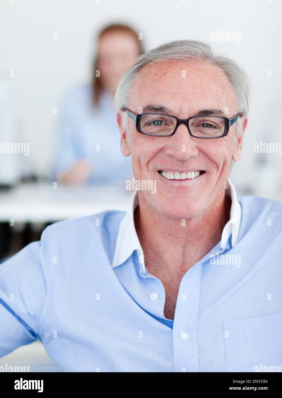 Senior manager wearing glasses Stock Photo - Alamy