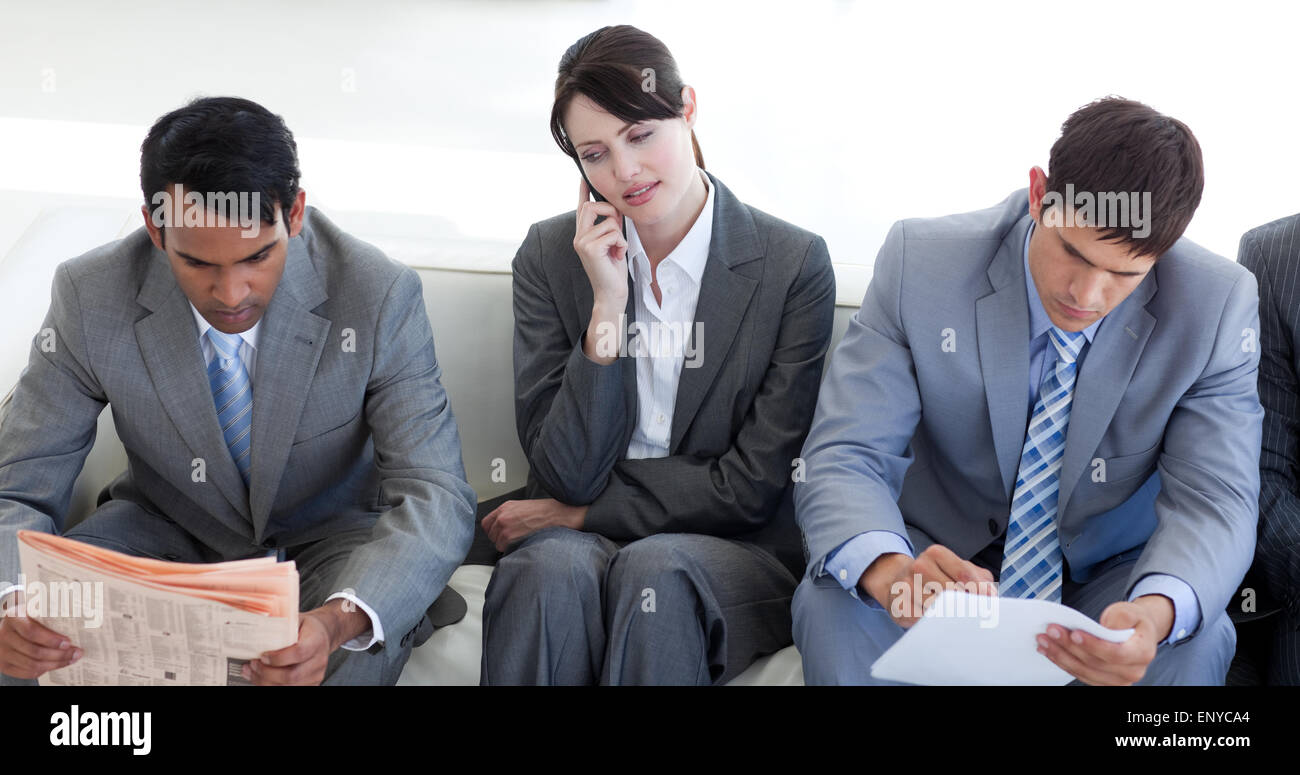 Serious Business people sitting and waiting for a job interview Stock ...