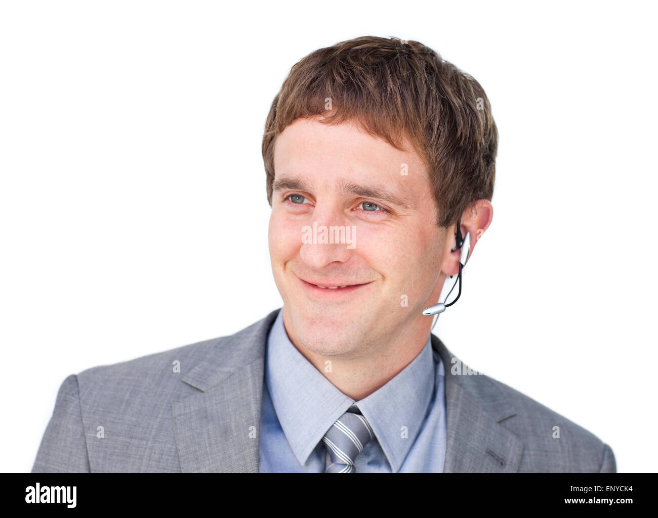 Young customer service agent with headset on against a white background ...
