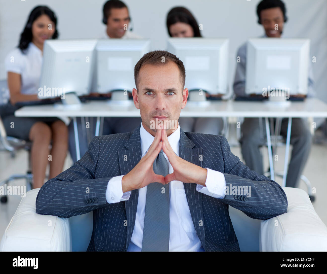 Serious young businessman looking laughing hi-res stock photography and ...