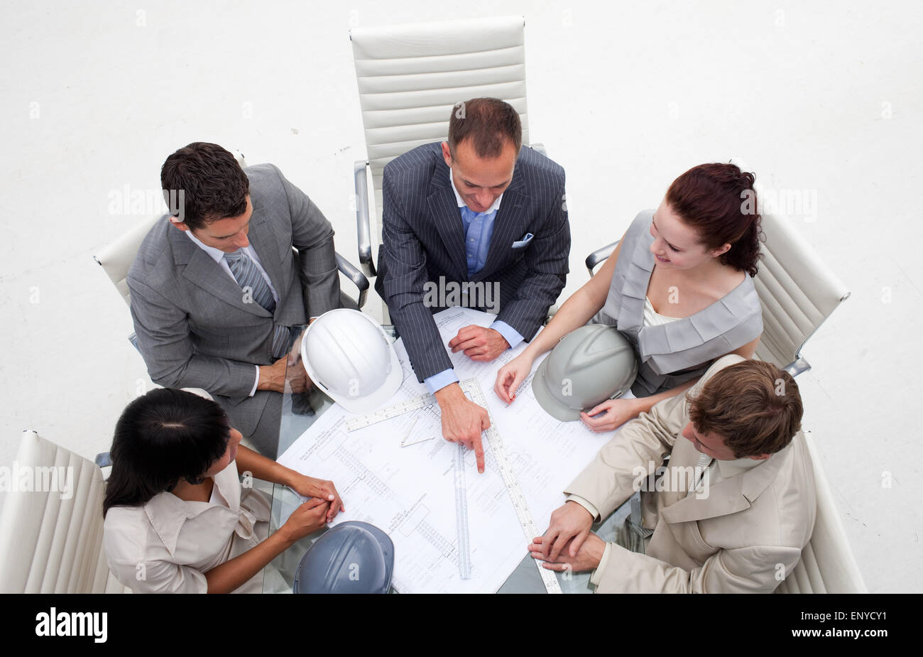 High angle of architects working with blueprints Stock Photo - Alamy