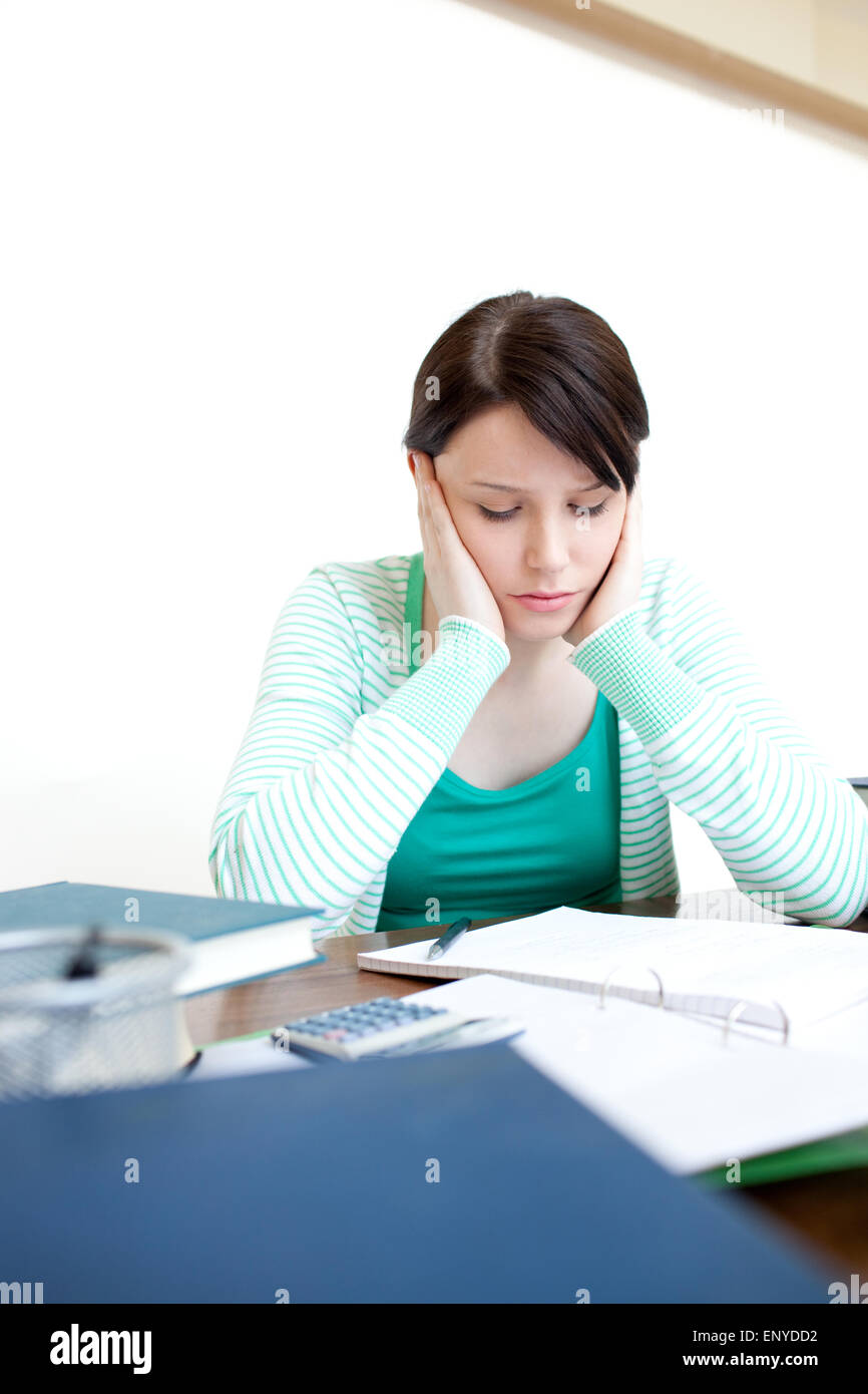 Bored student doing her homework Stock Photo - Alamy